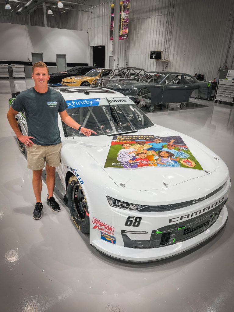 Brandon Brown is Bringing Autism Awareness to NASCAR One Sign at a Time